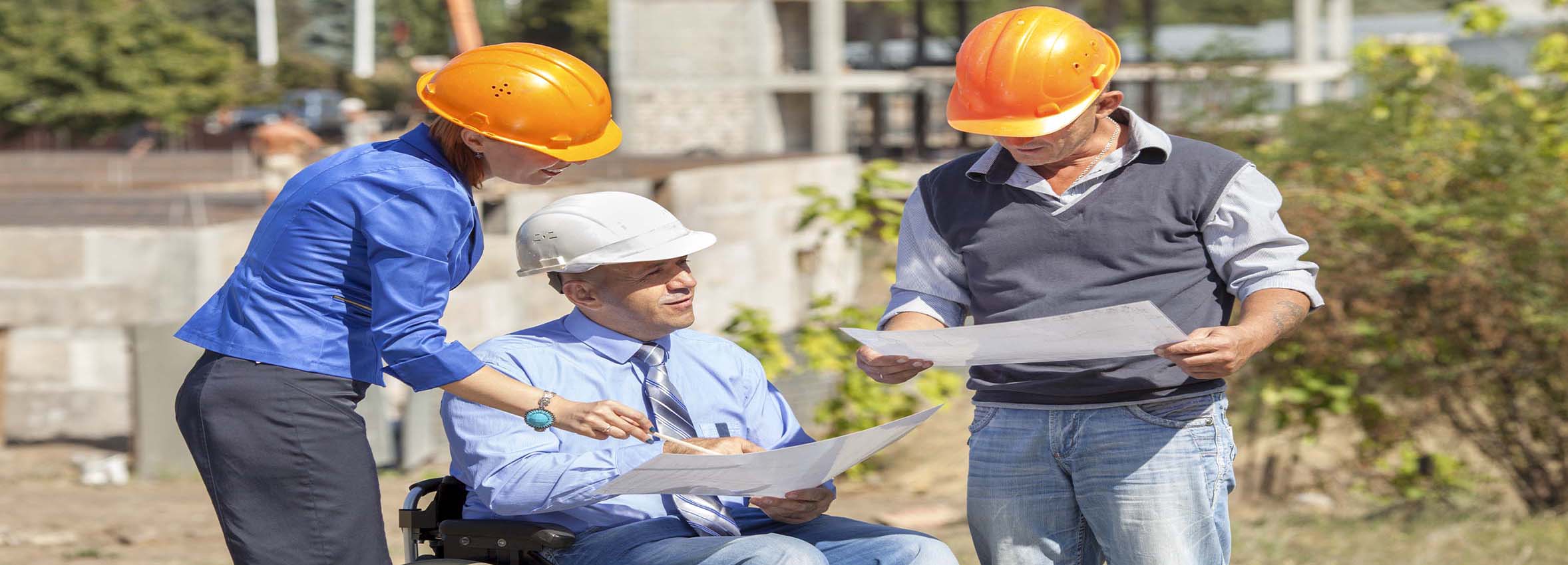 Disabled person in the construction helmet with documents in han - Aspiria